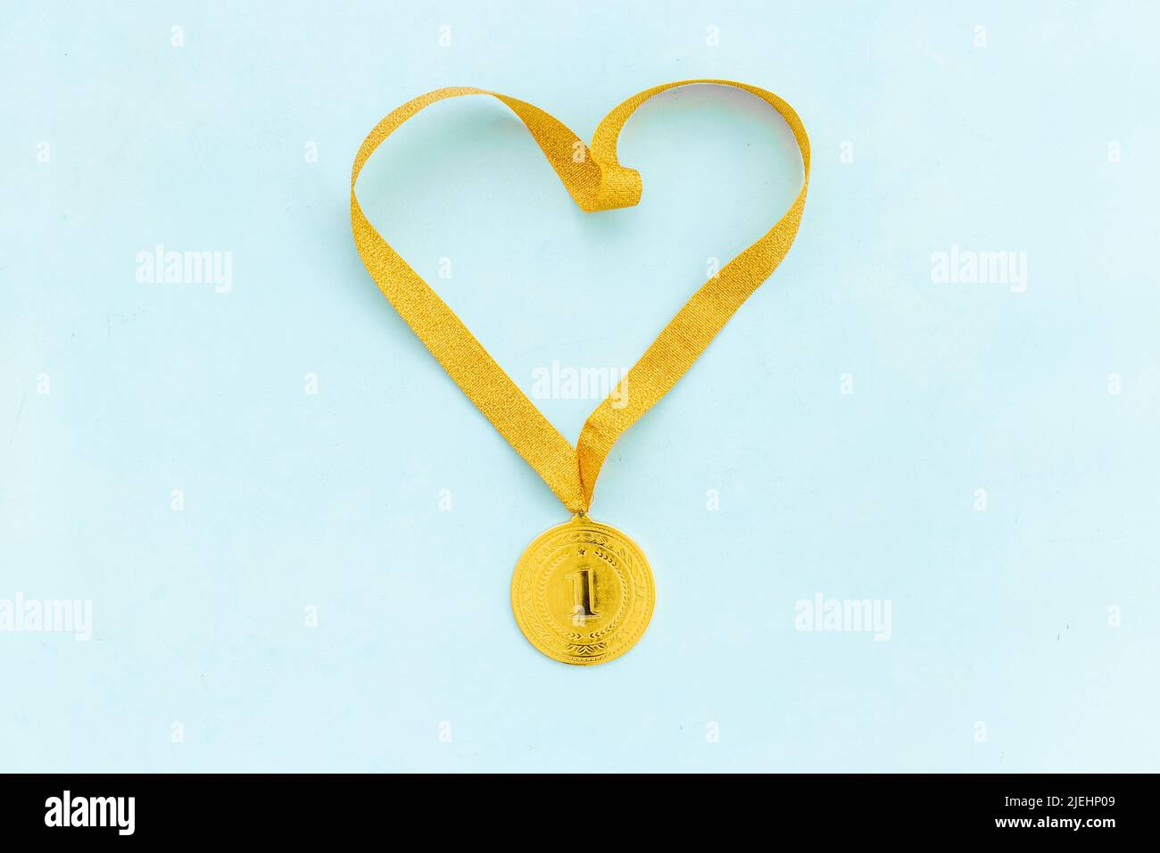 Gold medal first place on ribbon. Winner or champion trophy Stock Photo ...