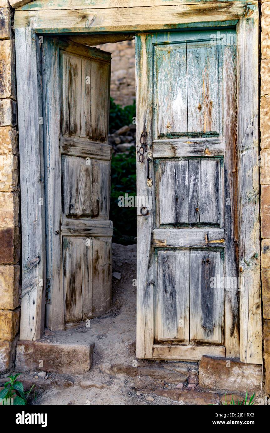 ancient wooden doors in the ruins of the abandoned village of Gamsutl ...