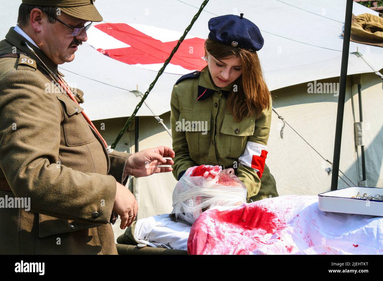 Warsaw, Poland - 15 august 2008: Dressing wound of injured soldier in ...