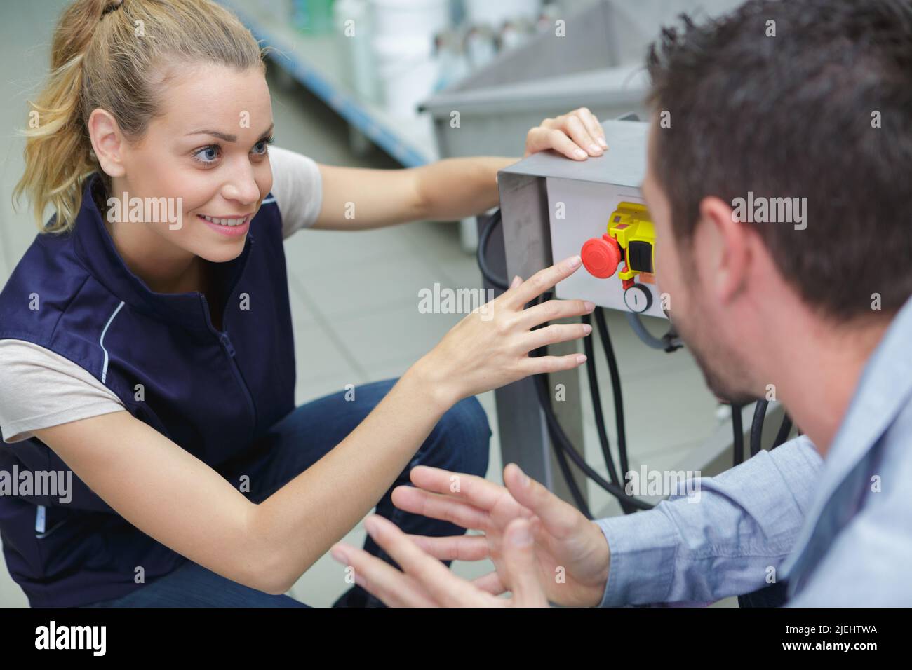 female worker operating a machine Stock Photo - Alamy