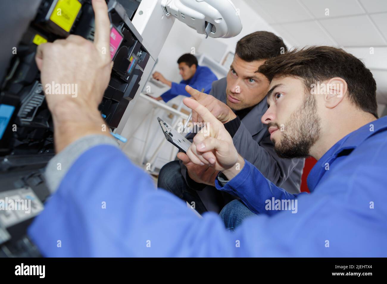 man fixing a broken ink jet printer Stock Photo - Alamy