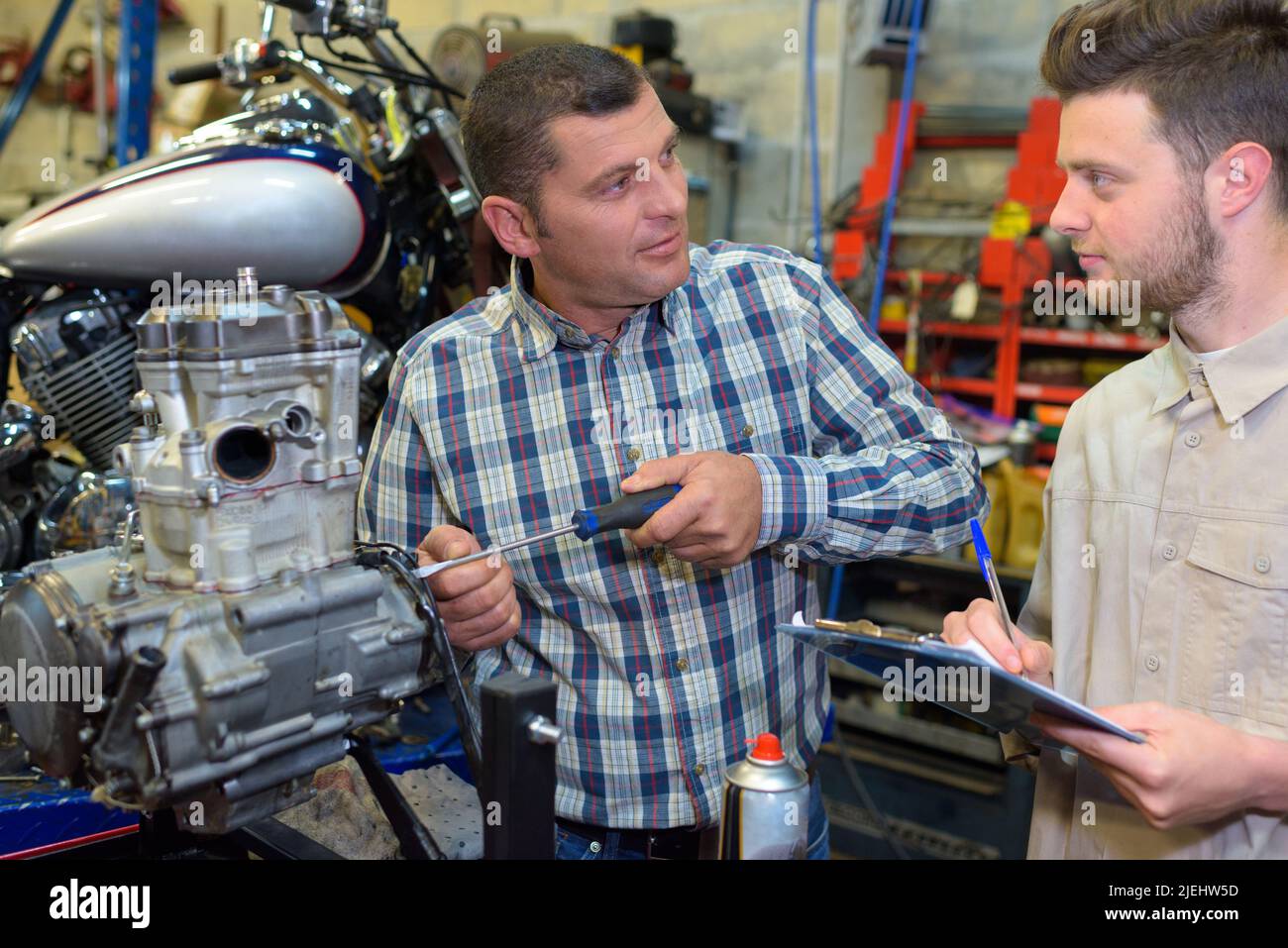 a man is fixing engine Stock Photo - Alamy
