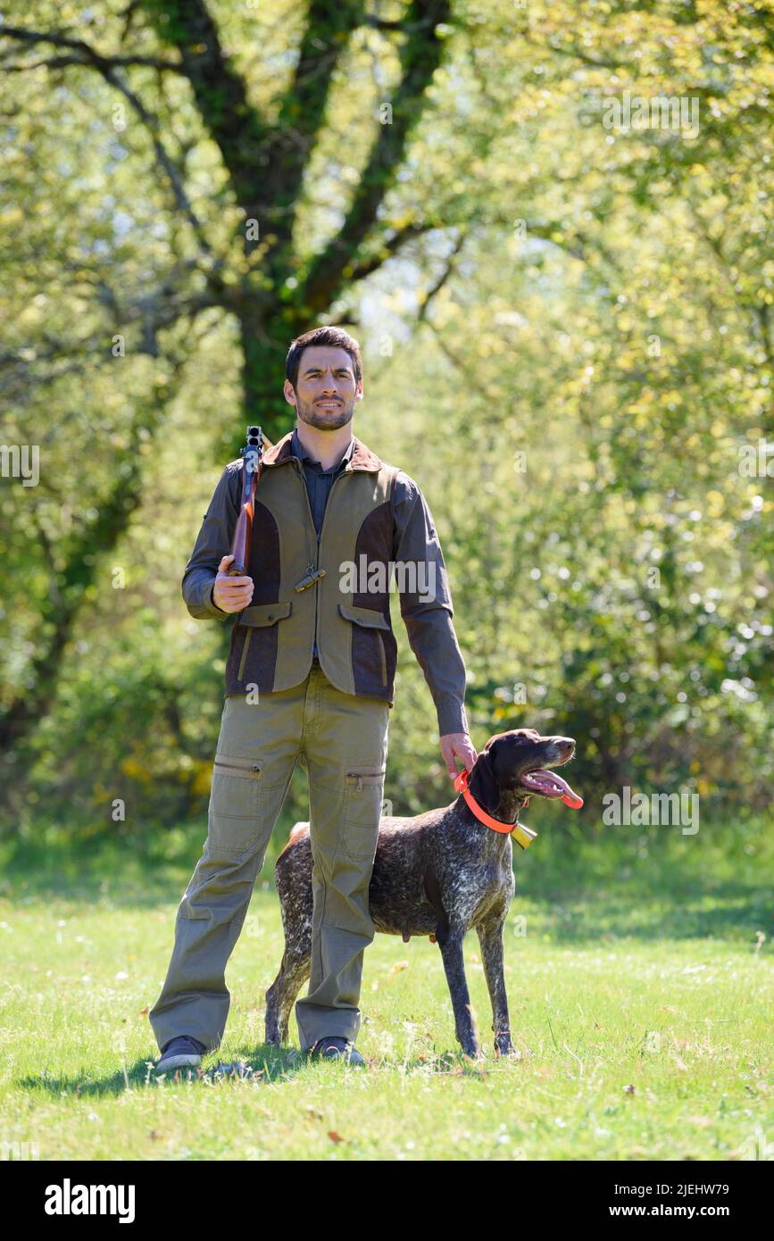portrait of hunter with a dog Stock Photo - Alamy