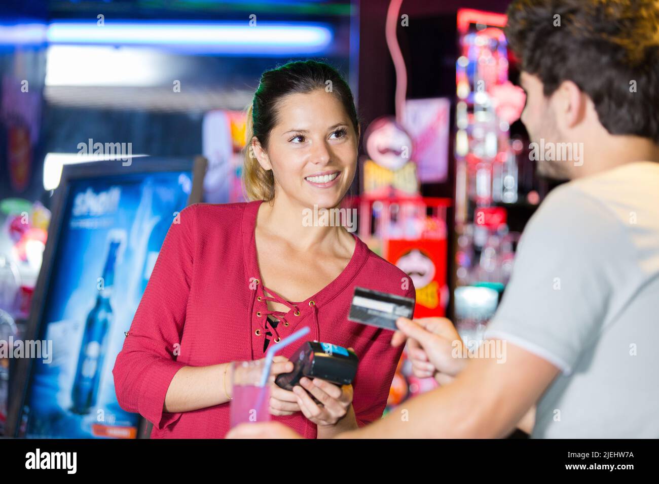 customer making payment through payment terminal at counter Stock Photo ...