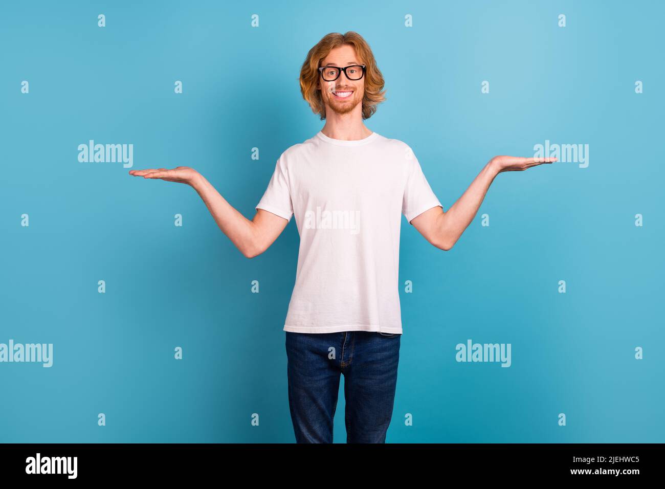 Photo of positive person arms palms demonstrate empty space vs scales ...