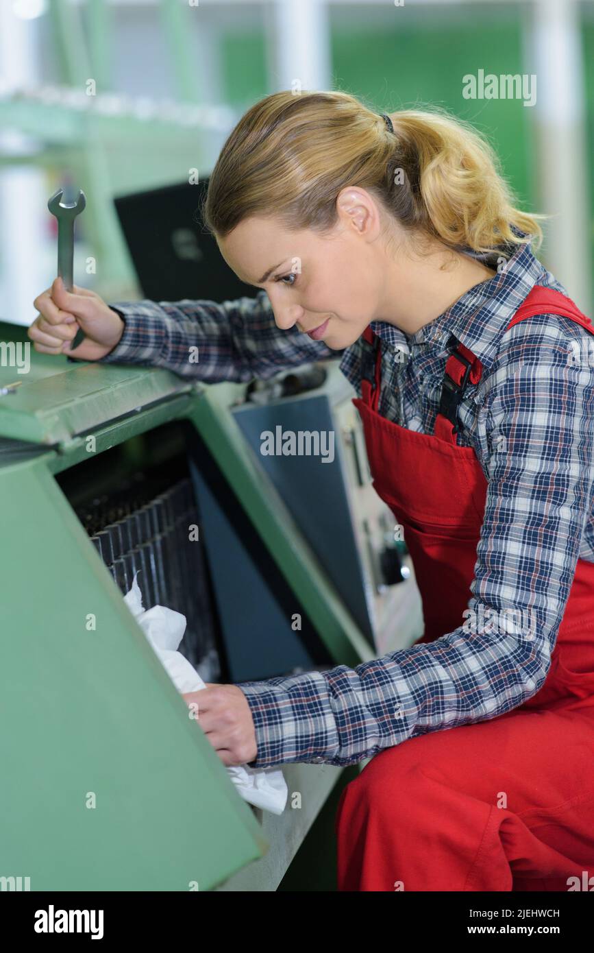 woman operating a machine with tools Stock Photo - Alamy