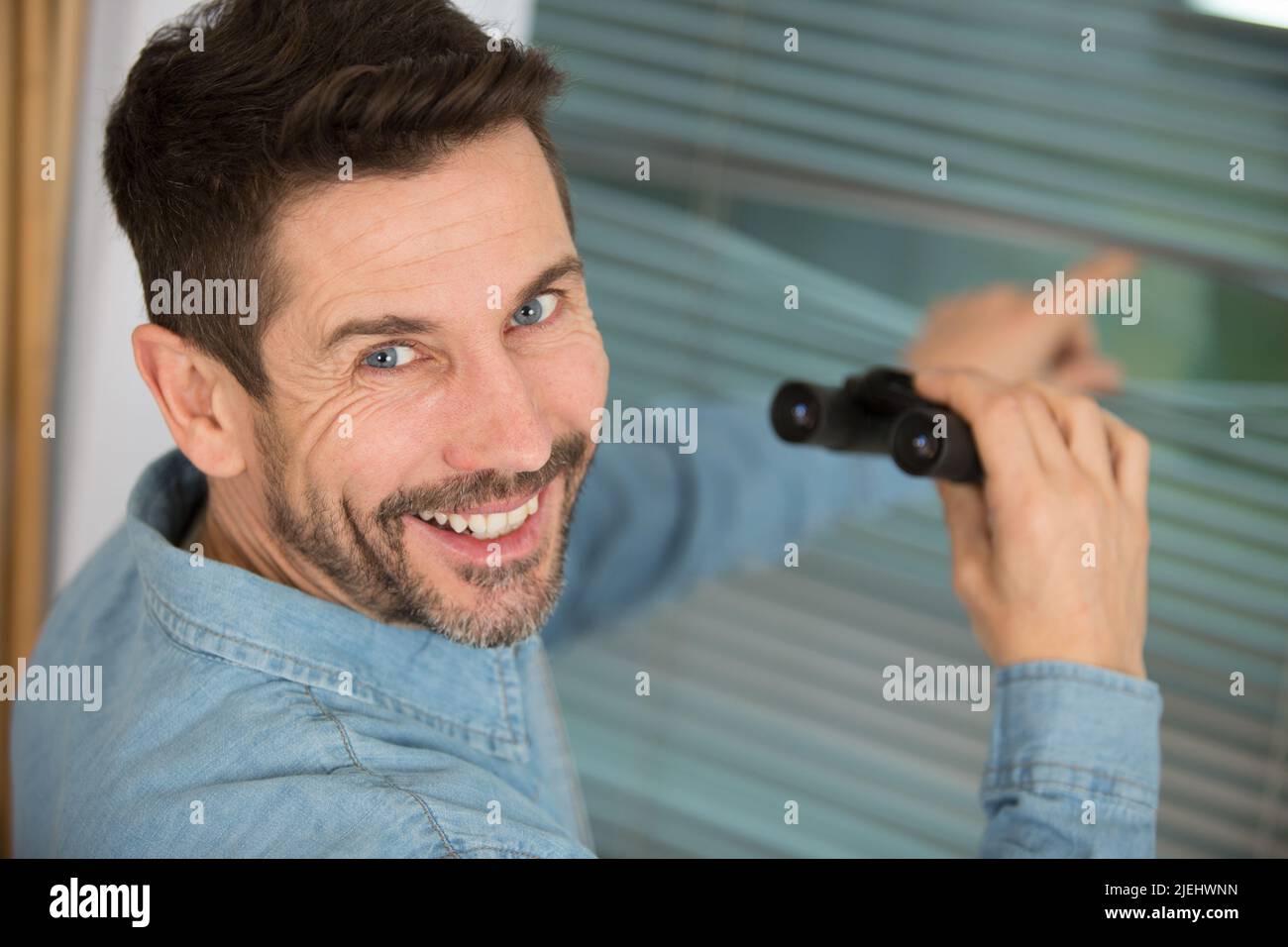 Binoculars looking through window hi-res stock photography and images ...