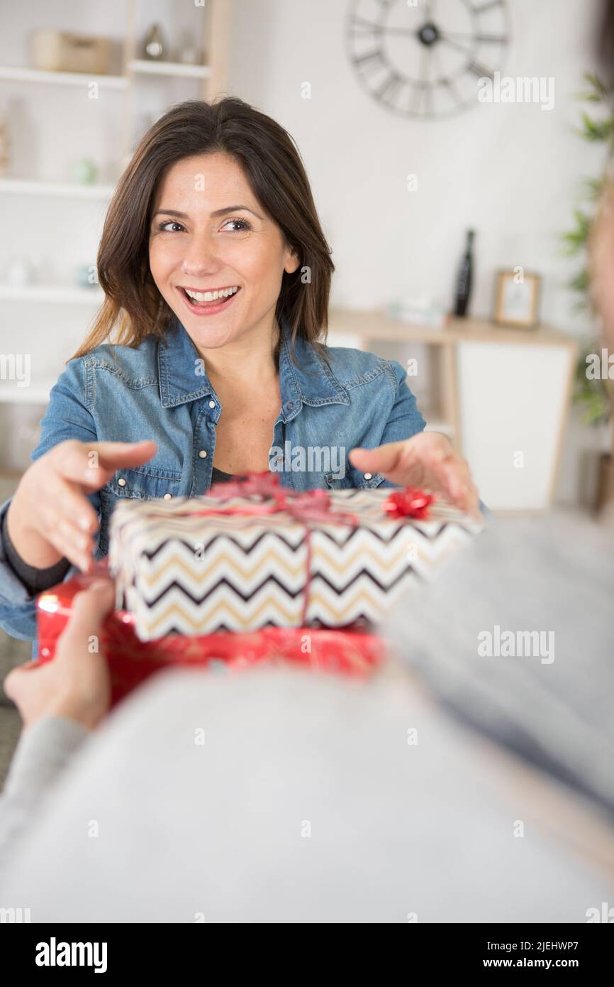 surprised person recieving a present Stock Photo - Alamy