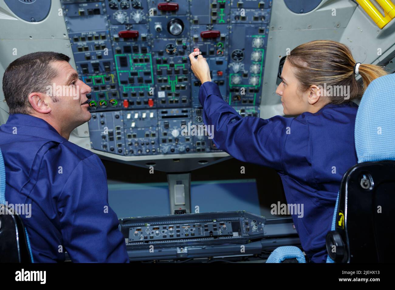 two maintenance engineers inside an airplane Stock Photo - Alamy