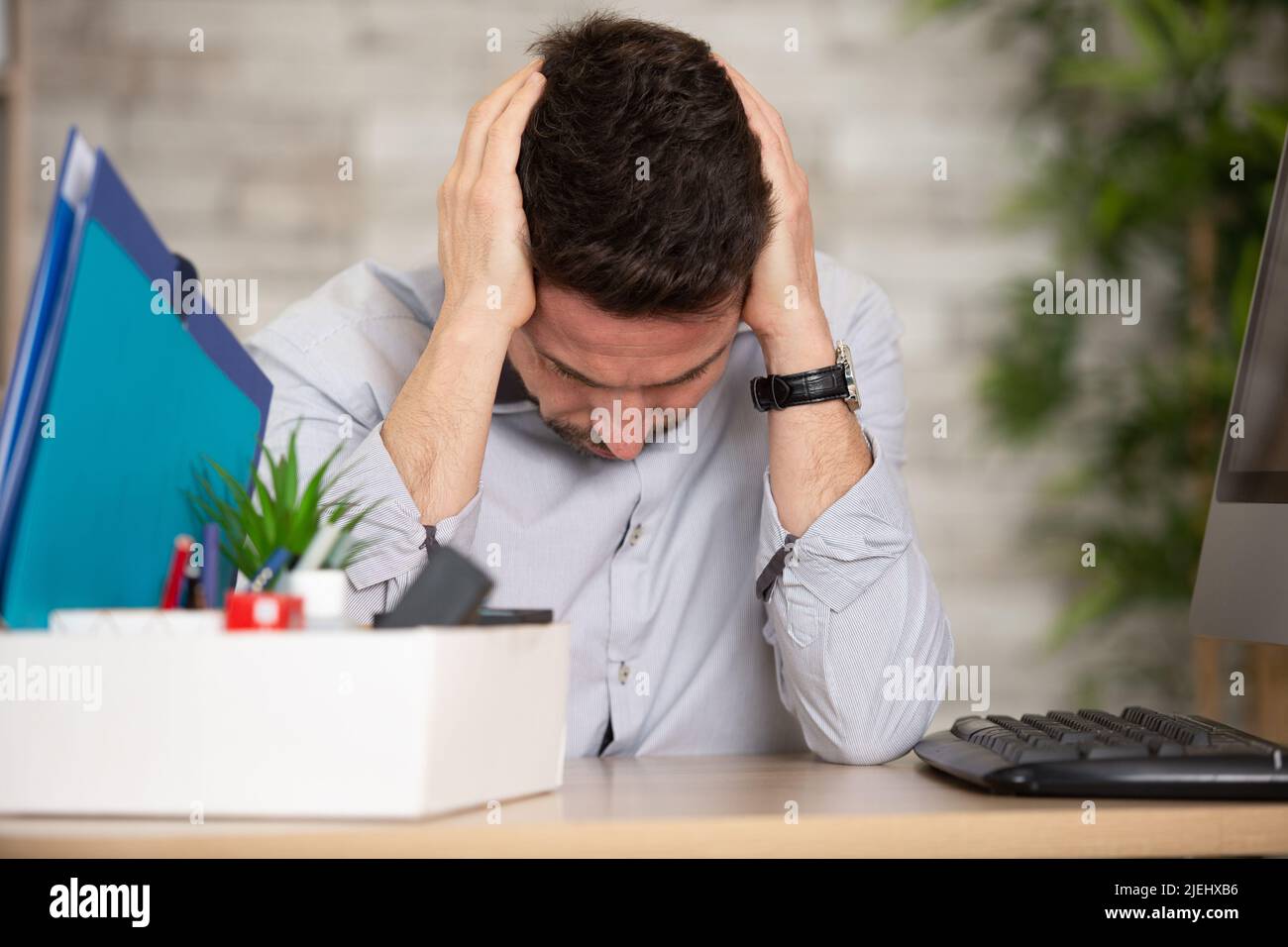 sad businessman leaving his company Stock Photo - Alamy