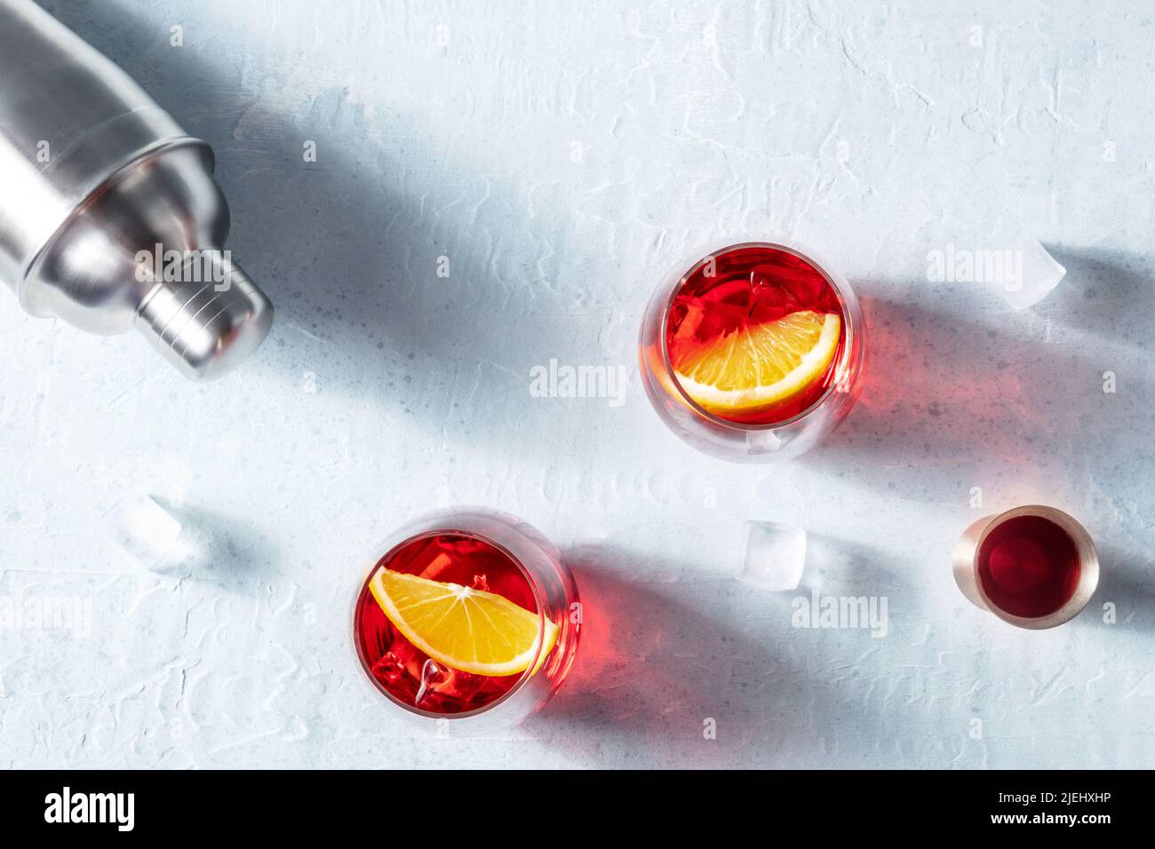 Campari orange cocktails with a jigger and a shaker, summer party ...