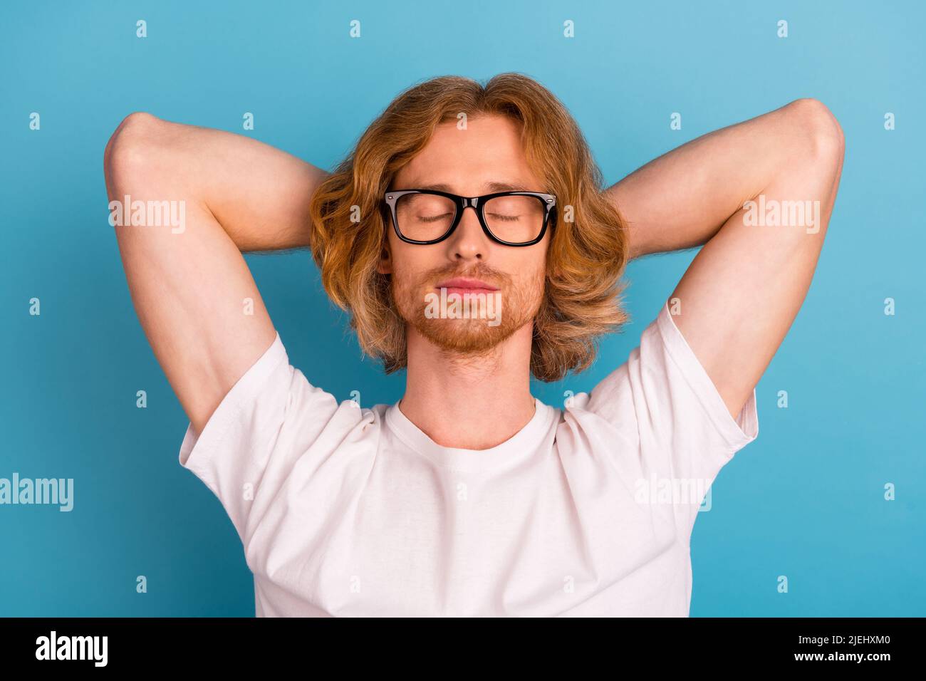 Male model arms behind head hi-res stock photography and images - Alamy