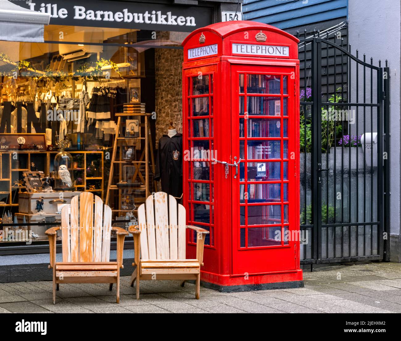 Red British Telephone Box used as a library, Haugesnd, Norway Stock ...