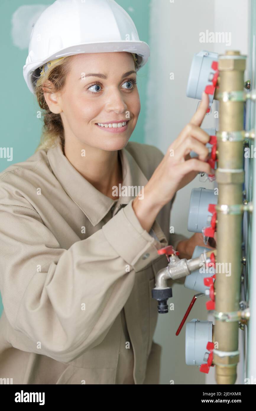 portrait of a female checking water meter Stock Photo - Alamy