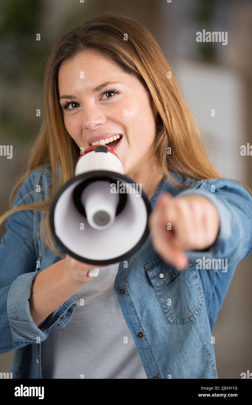 Young woman pointing viewer hi-res stock photography and images - Alamy