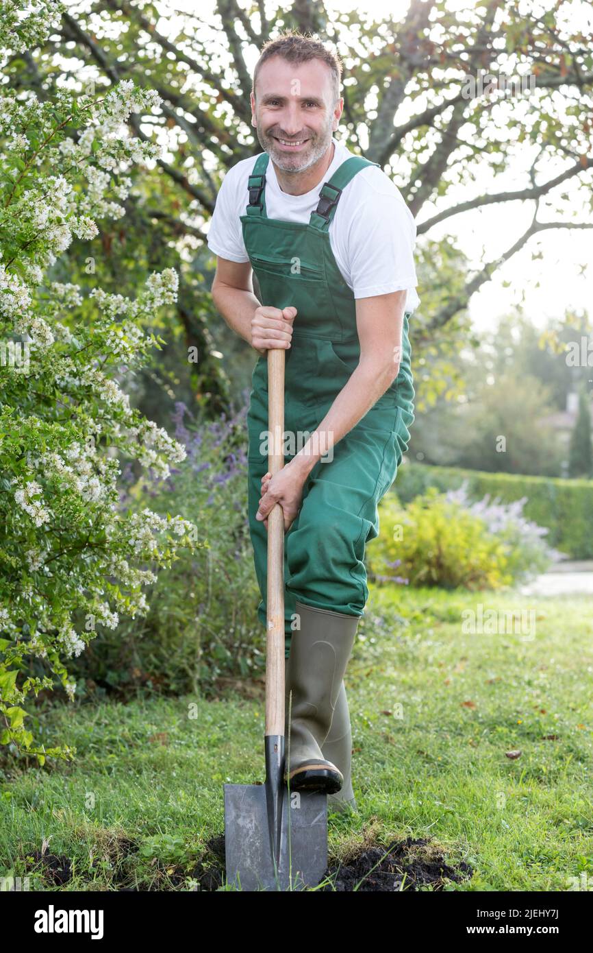 a man with the shovel Stock Photo - Alamy