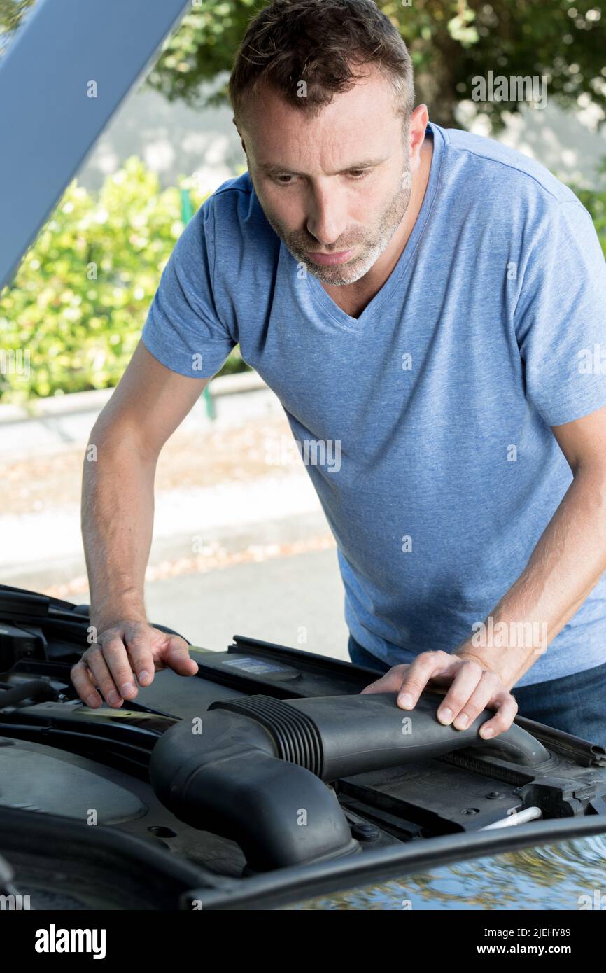 man looking under the hood of car Stock Photo - Alamy man looking under the hood of car Stock Photo - Alamy