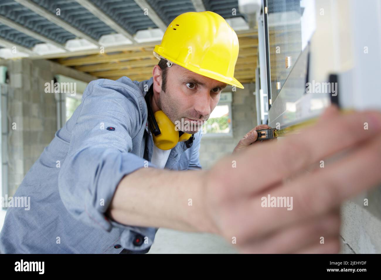 technician with measurement level during work Stock Photo - Alamy