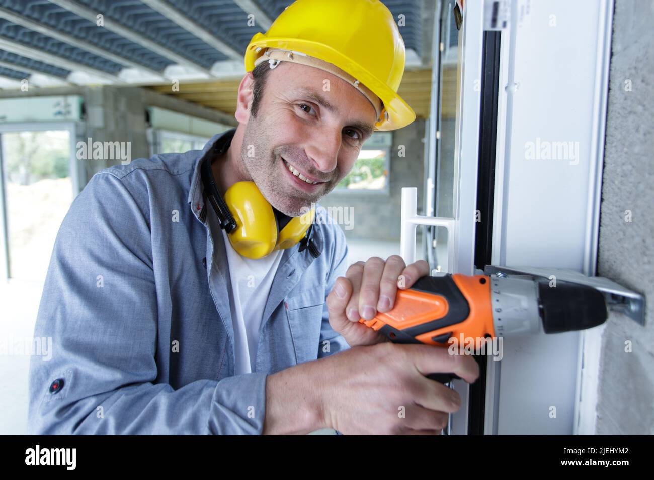 worker man drilling in concrete on a construction site Stock Photo - Alamy