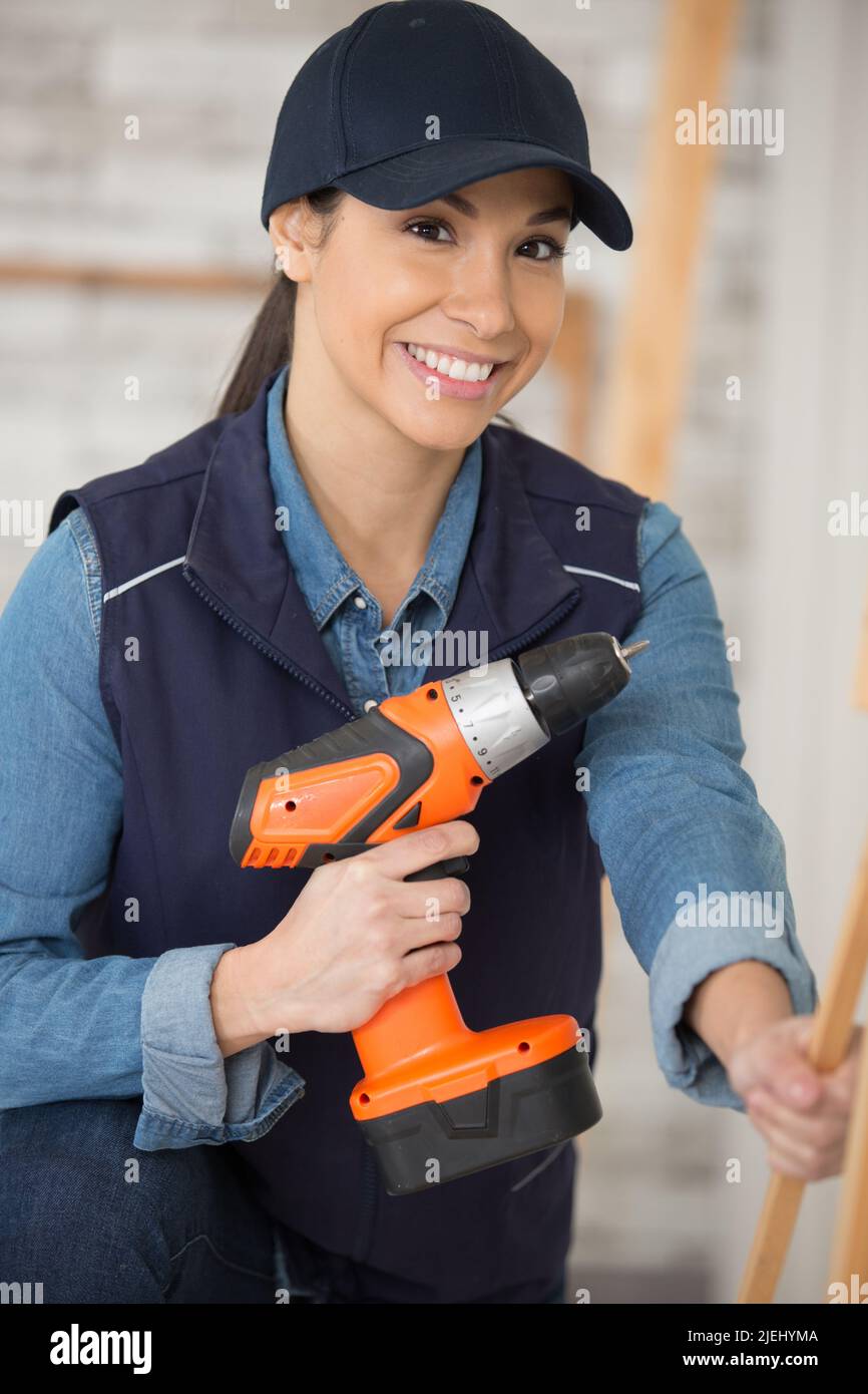 professional woman using cordless screwdriver Stock Photo - Alamy