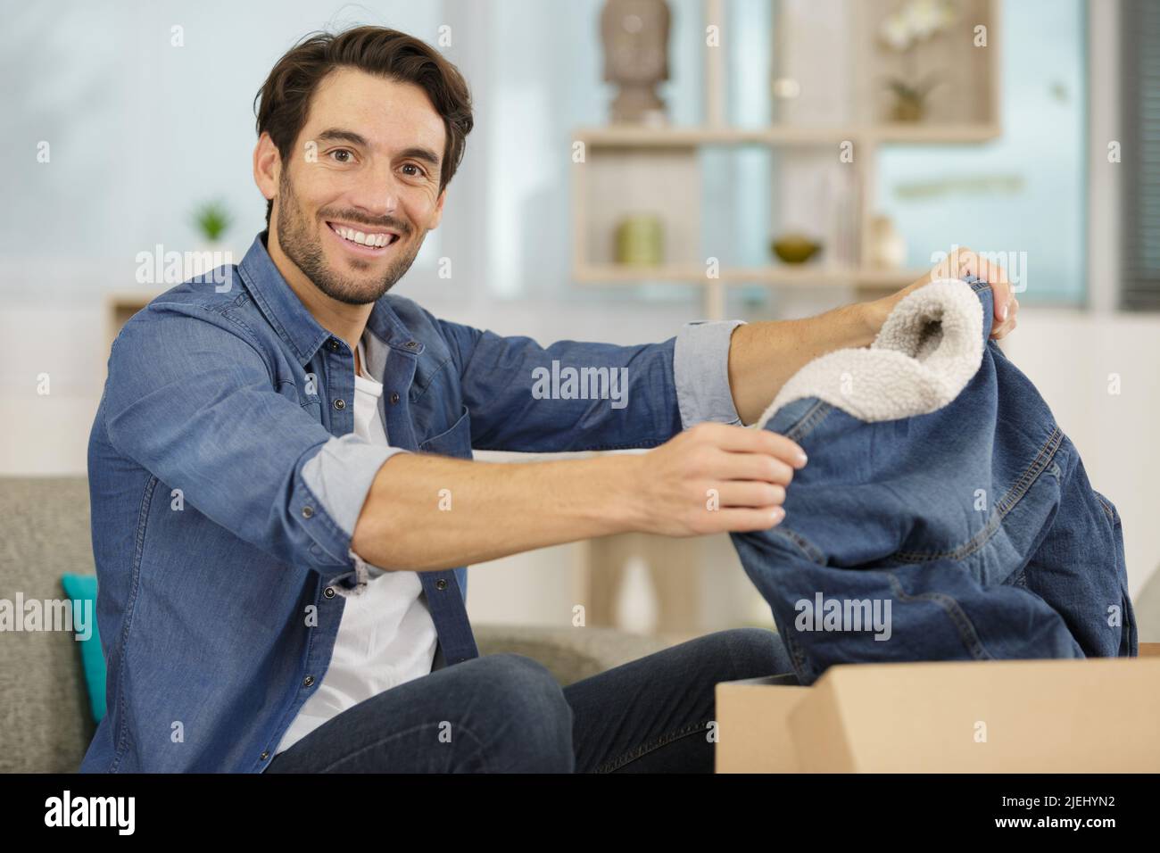man opening a parcel Stock Photo - Alamy