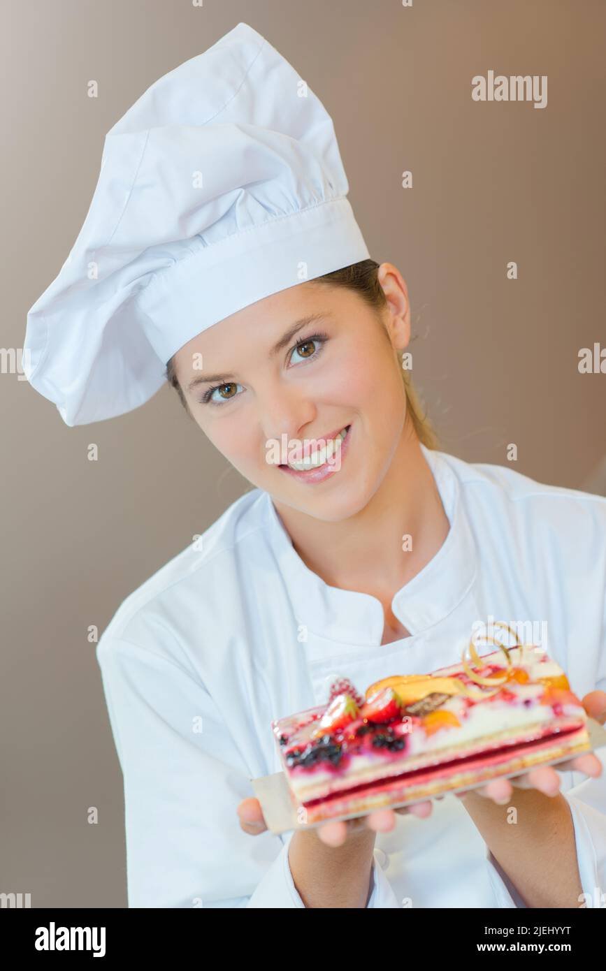 Female bakery chef with a fruit cake Stock Photo - Alamy