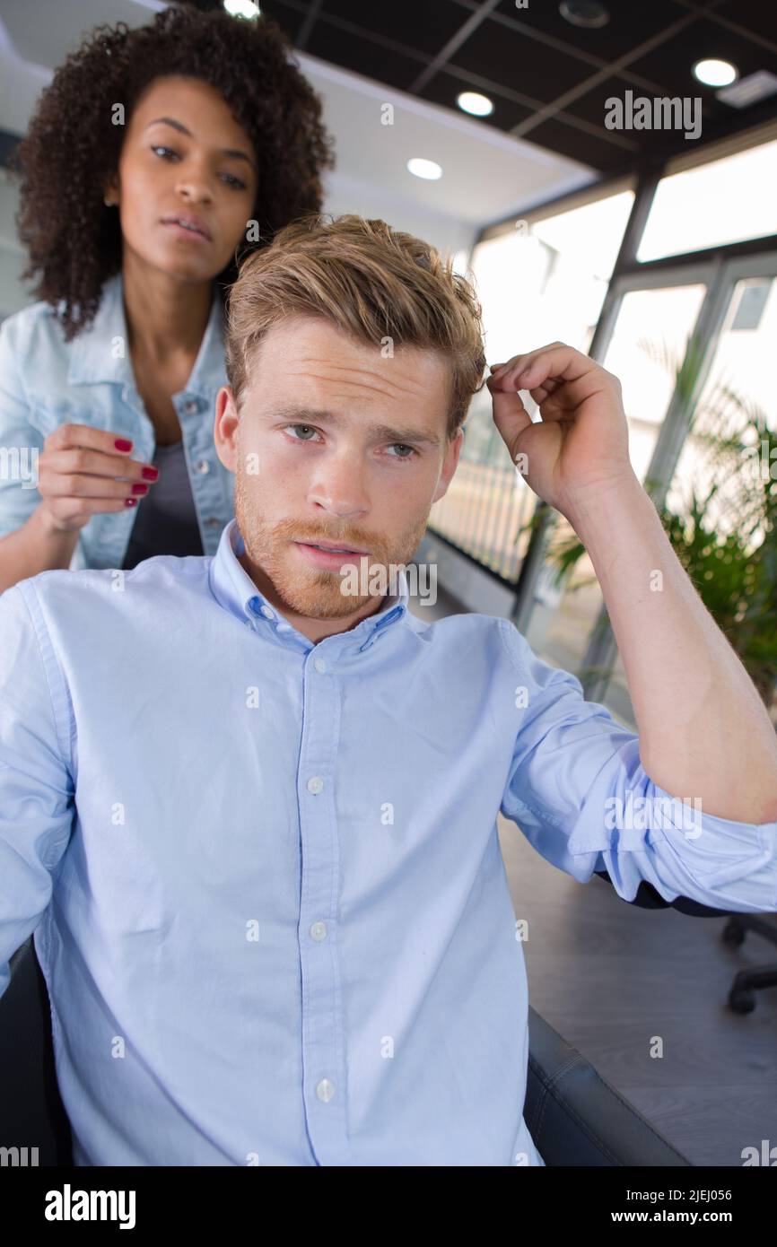 man having complaint on his hair style Stock Photo - Alamy