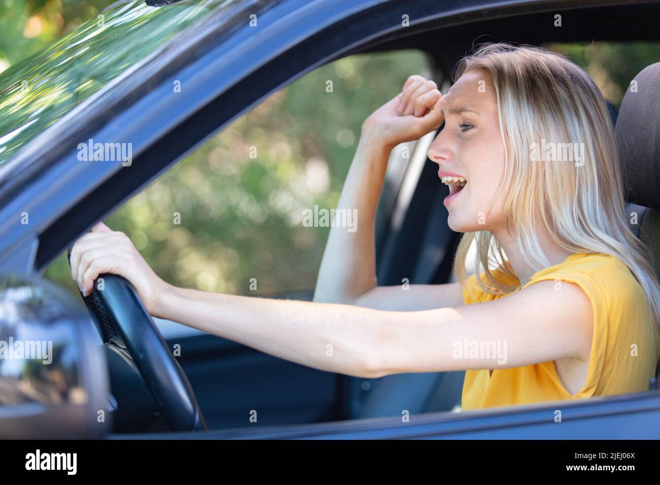side view window portrait displeased stressed angry woman driving car ...