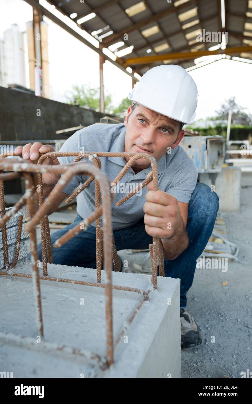 construction worker checking cement in factory floor Stock Photo - Alamy