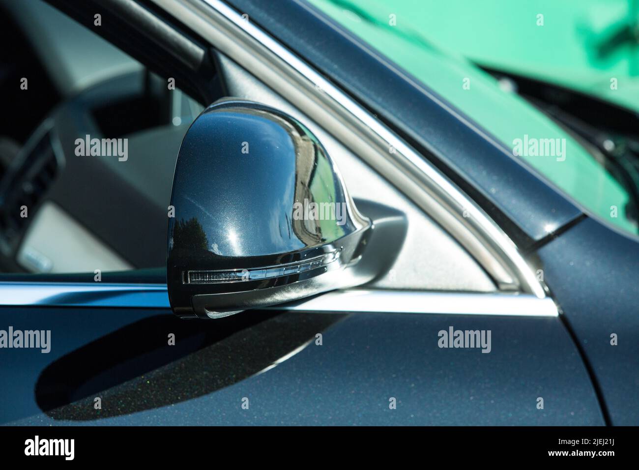 AUDI Q3 in black. Subcompact luxury crossover Audi Q3. Side mirror view ...