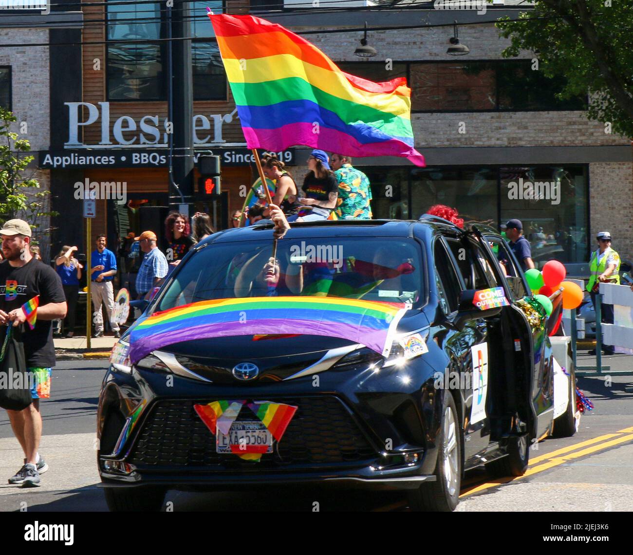 Babylon, New York, USA - 5 June 2022: Large rainbow flag sticking out ...