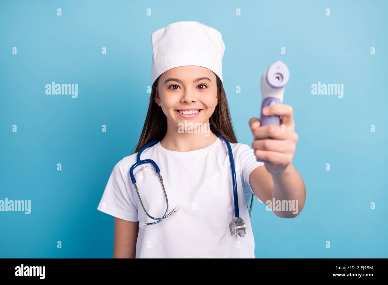 Photo portrait of small nurse with stethoscope measuring temperature ...