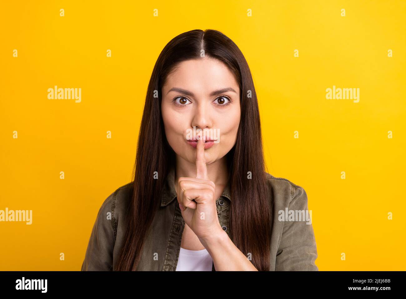 Photo of silent scared young woman hold hands finger mouth lisp secret ...