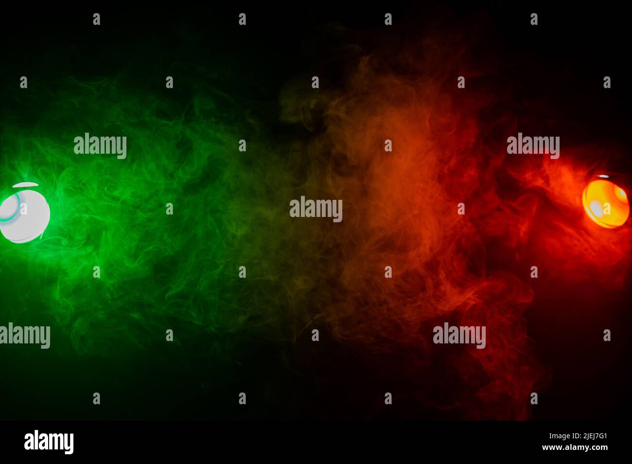 Red green smoke on a black background Stock Photo - Alamy