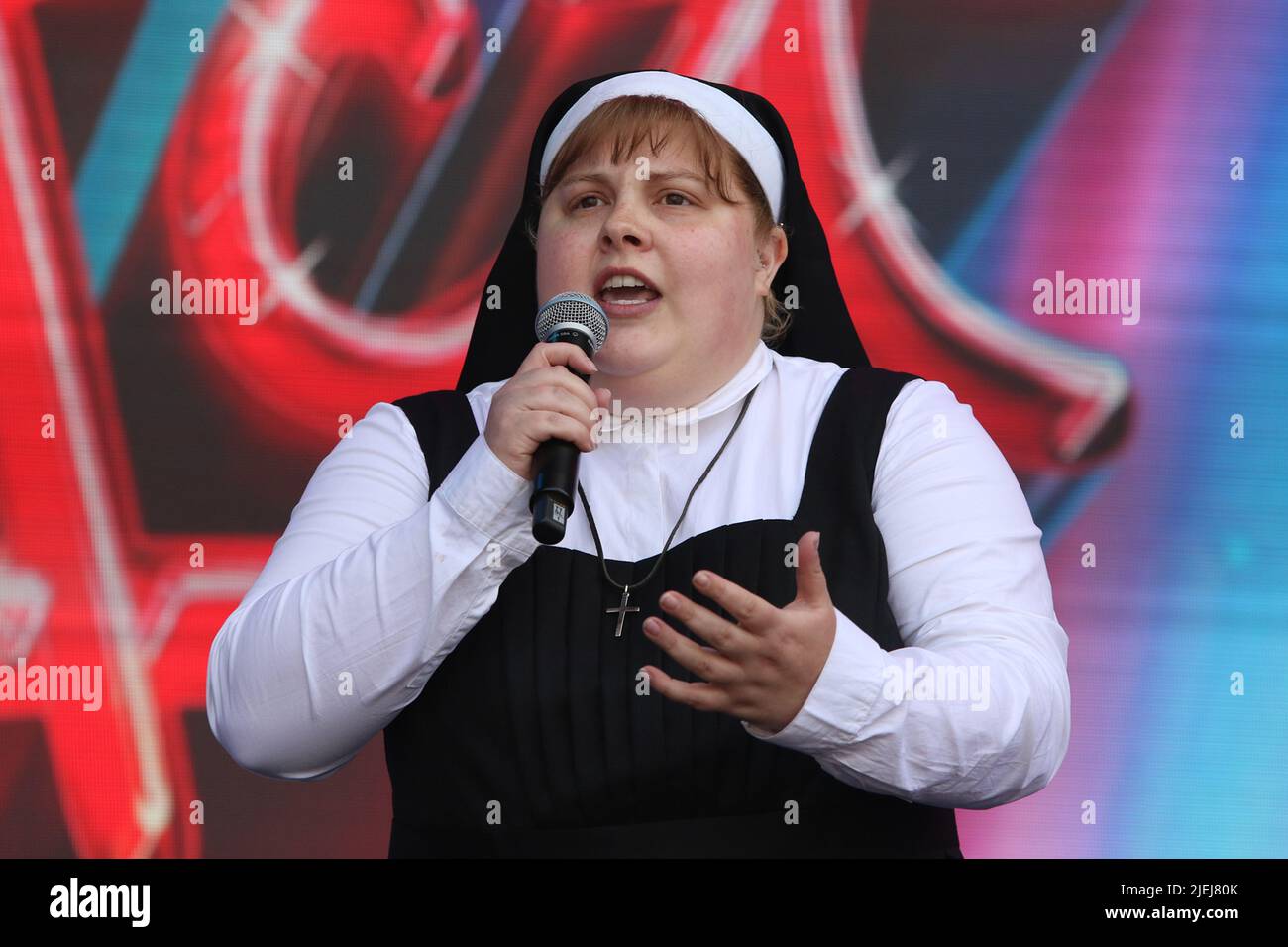 Lizzie Bea performing at West End Live in Trafalgar Square 2022 with a ...