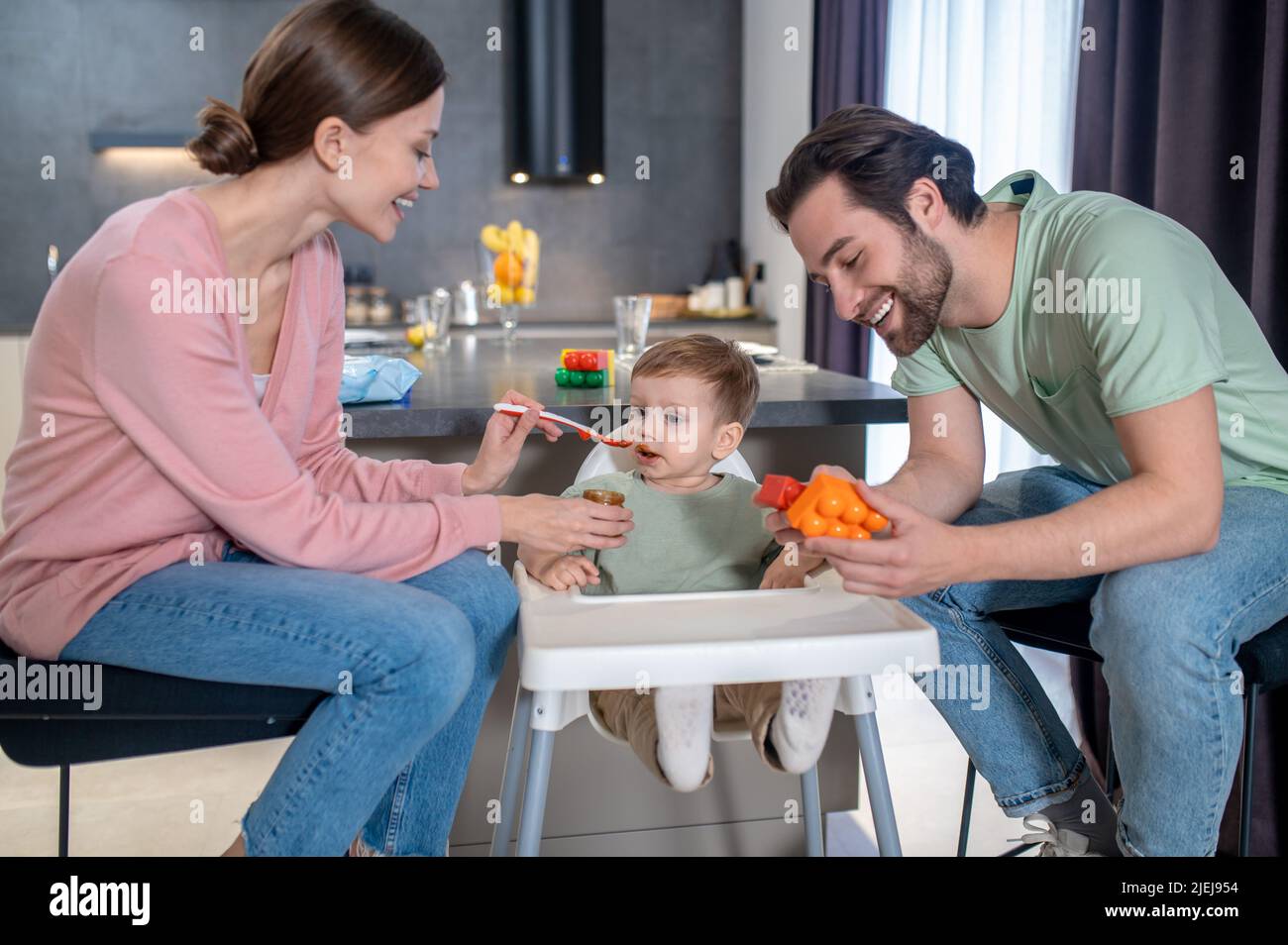 Mom feeding boy hi-res stock photography and images - Alamy