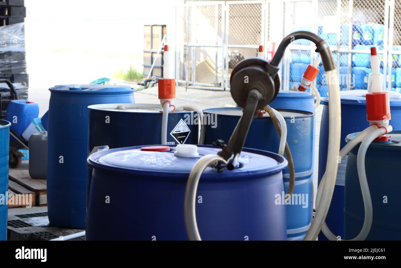 Chemical tank in the factory and Pump Stock Photo - Alamy