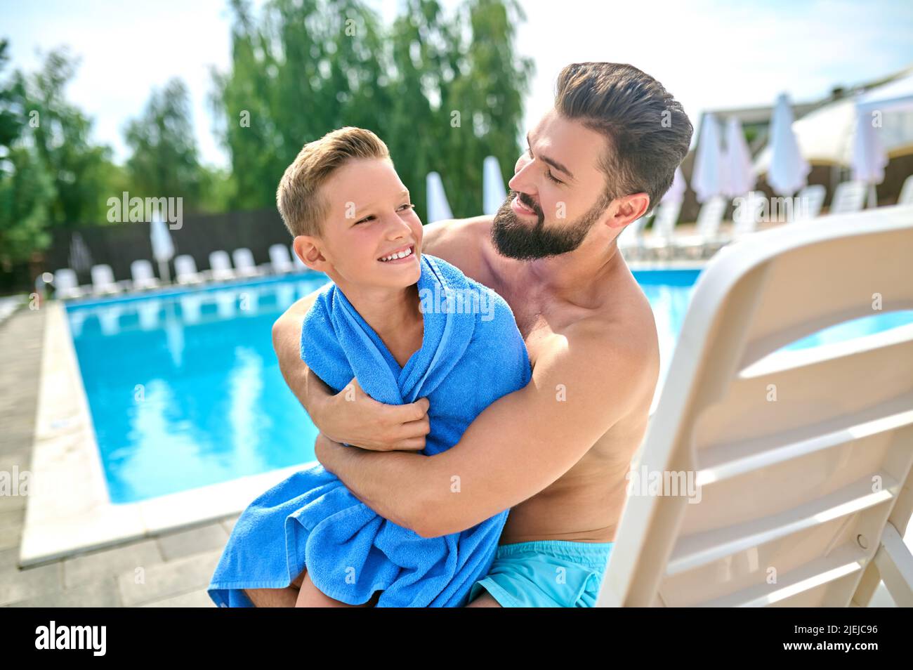 Kid sunbathing in the pool hi-res stock photography and images - Alamy