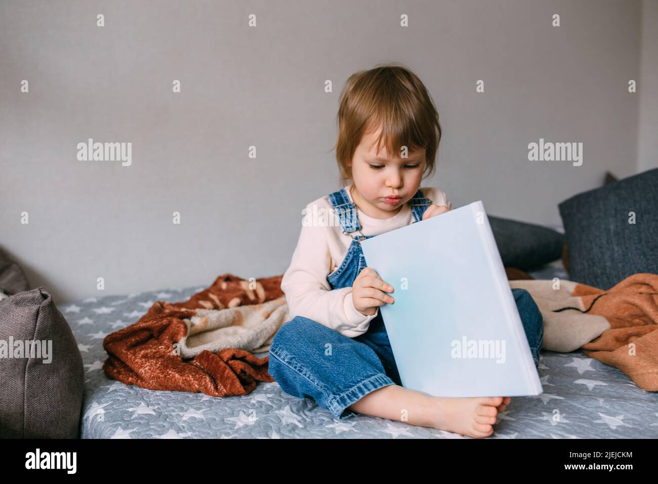 Kid reading fairy tales in bed hi-res stock photography and images - Alamy