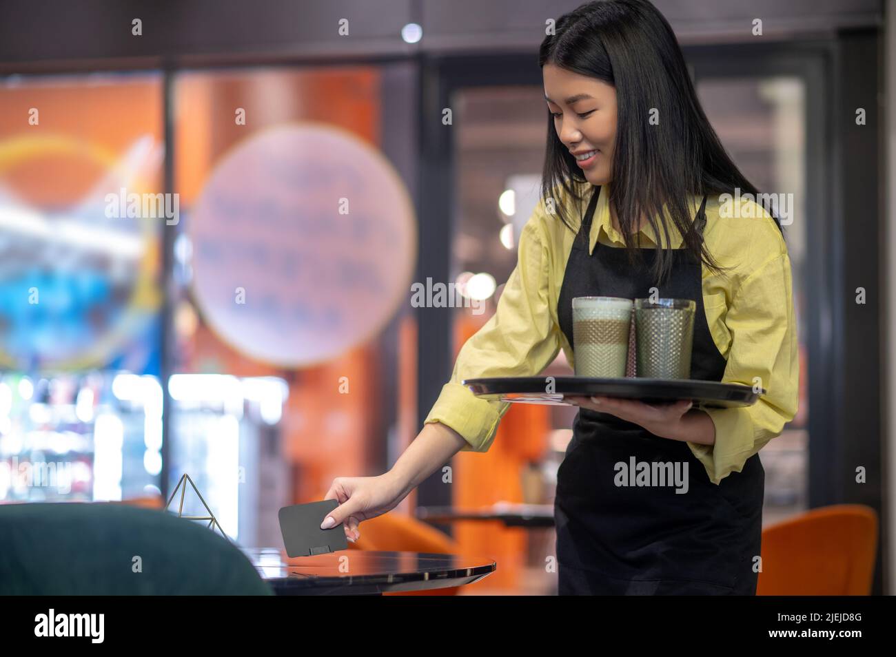 Woman tray drinks hi-res stock photography and images - Alamy