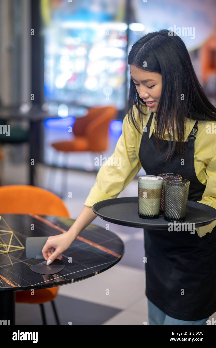 Person in cafe putting on hi-res stock photography and images - Alamy