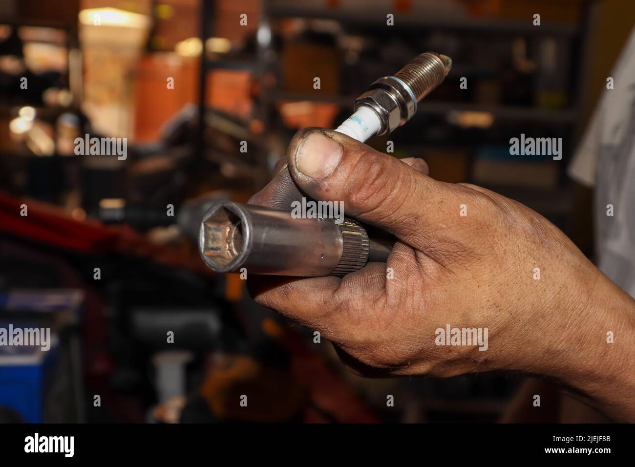 Maintenance spark plug of car Stock Photo - Alamy