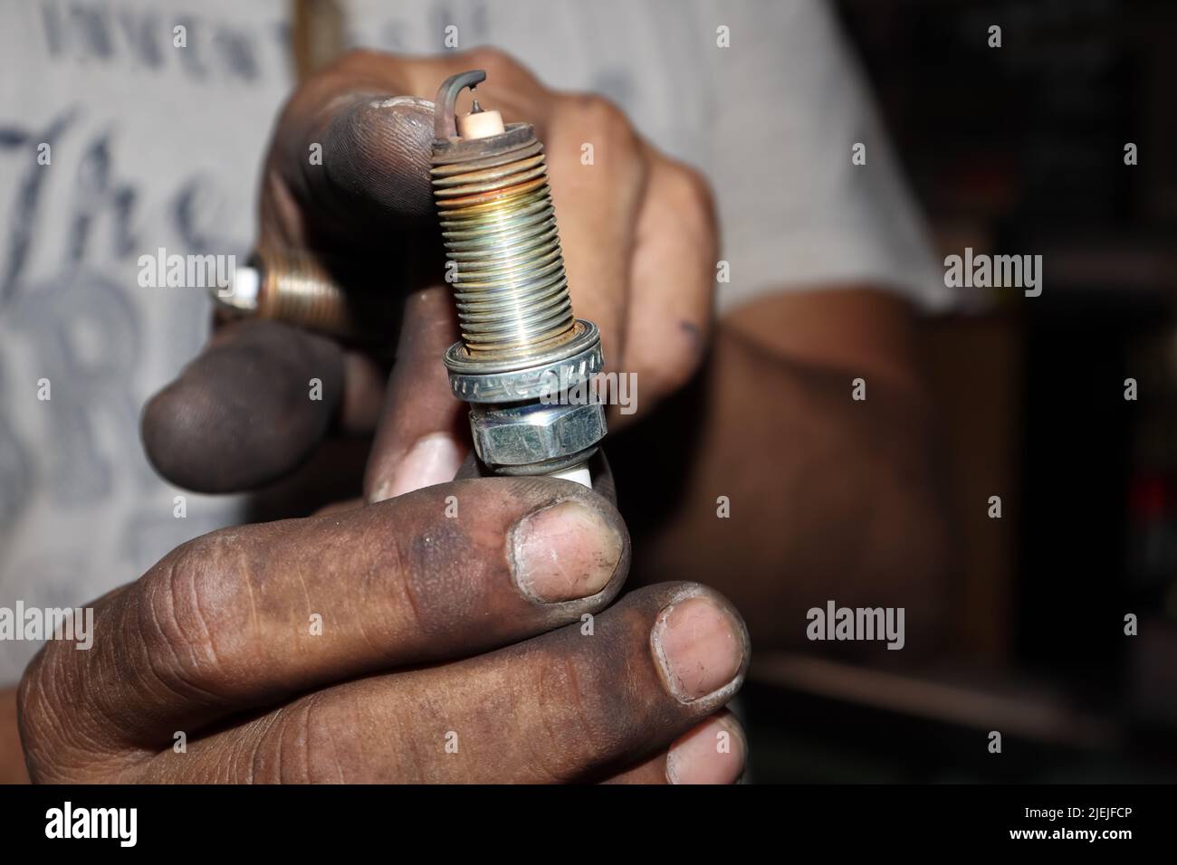 Maintenance spark plug of car Stock Photo - Alamy