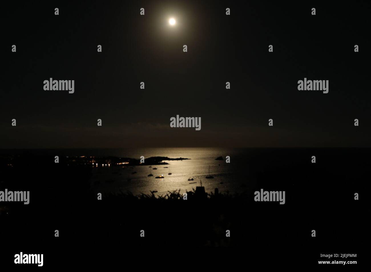 Full moon reflection on Ocean in Cadaques Stock Photo - Alamy