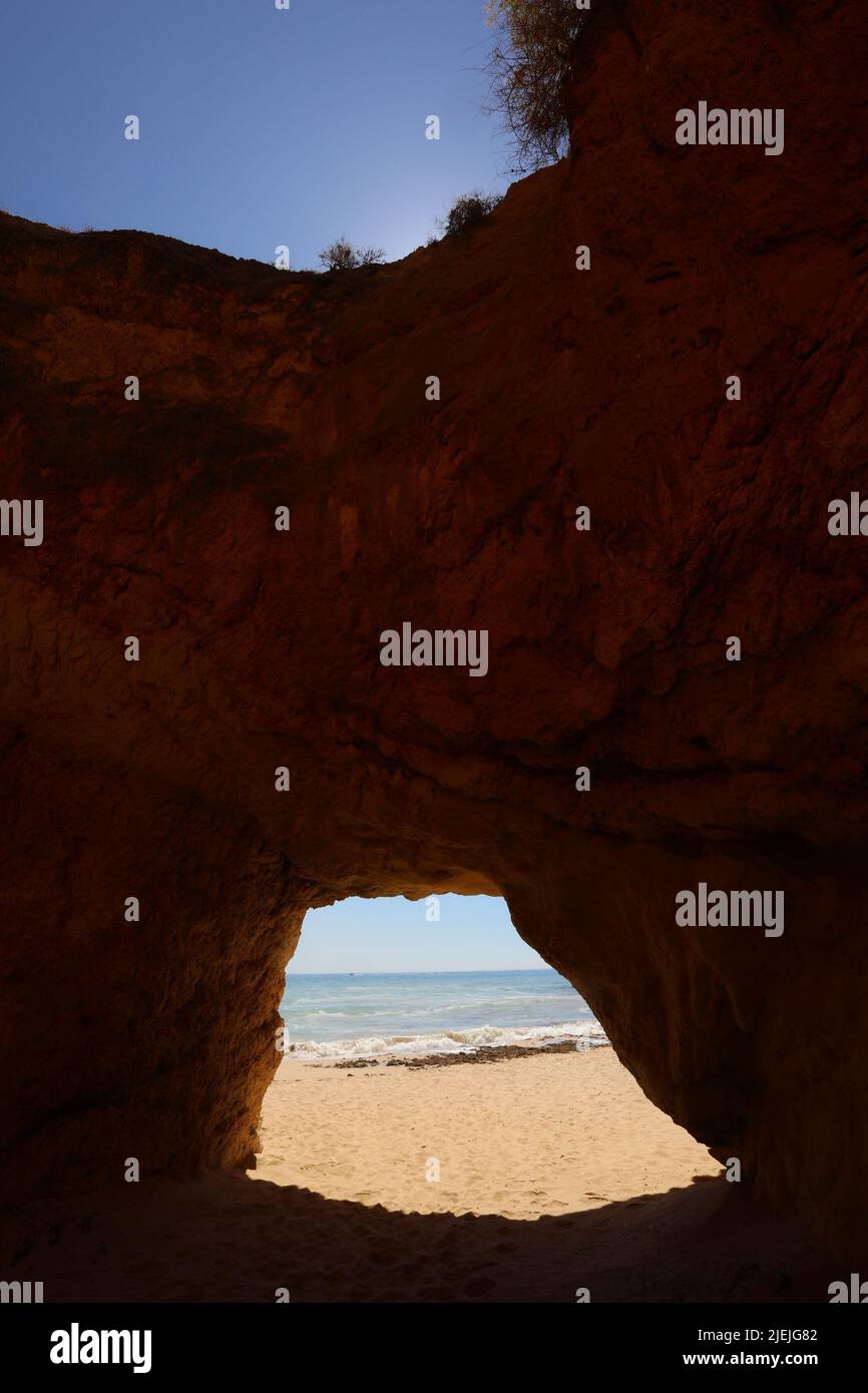 Hidden beach by the ocean sea with natural cave and sand Stock Photo ...
