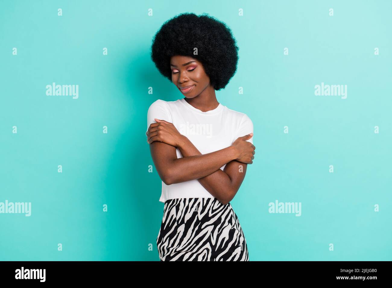 Photo of enjoy short hairdo young lady hug herself wear white t-shirt ...