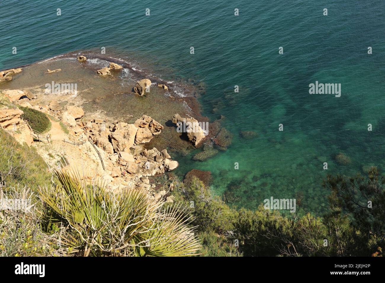 Turquoise sea on rocky ocean beach Stock Photo - Alamy