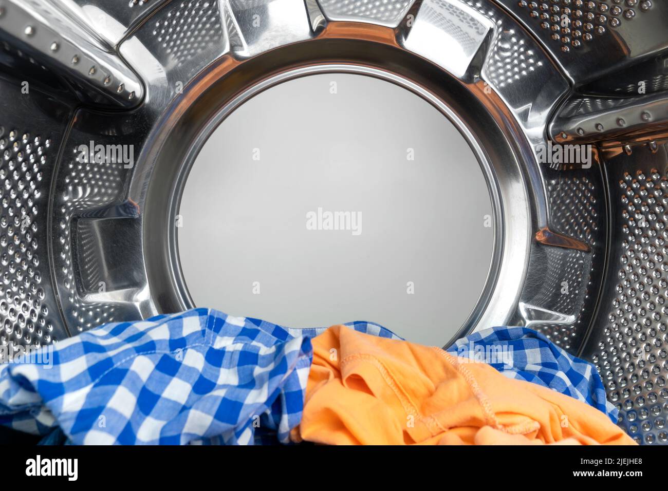 Washing machine drum clothes hi-res stock photography and images - Alamy