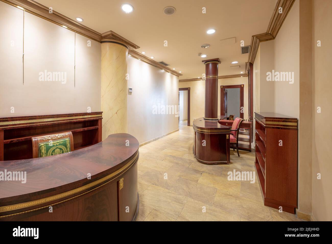 Wooden counters of a professional office with marble floors and ...