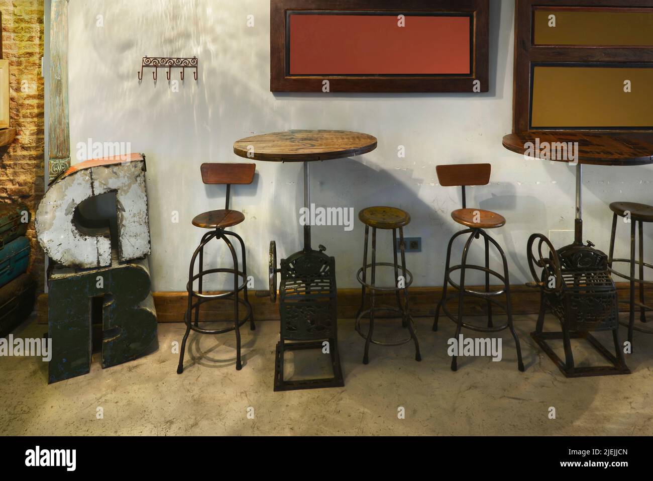 Living room detail with decorative high tables with recycled materials ...